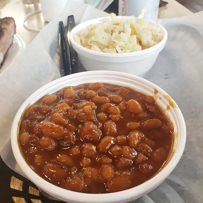 Baked beans that have clearly been introduced to the brisket drippings. Not a side dish—more like a supporting actor deserving its own award.