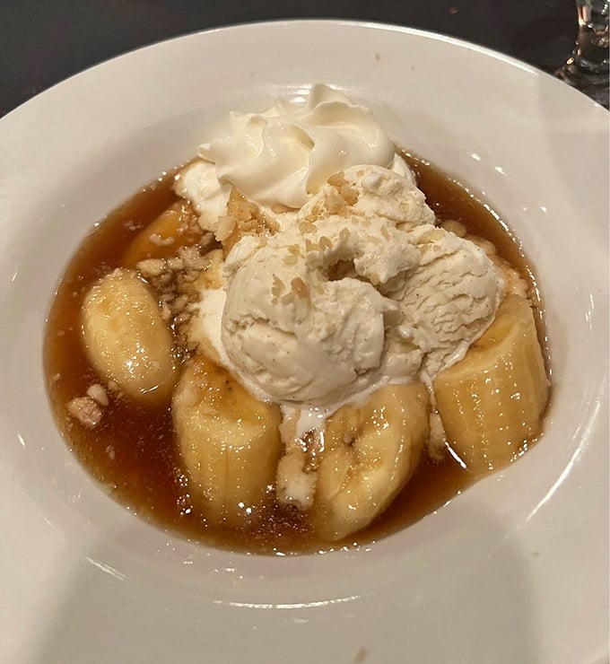 Bananas Foster's sweet, caramelized glory topped with vanilla ice cream—proof that the simplest ingredients can create the most profound pleasures.