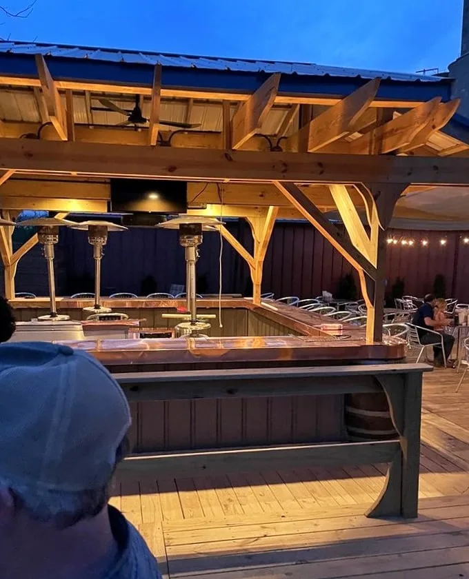The outdoor bar area transforms ordinary summer nights into something special—just add friends, drinks, and Illinois starlight.