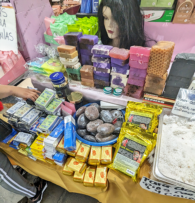 Handcrafted soaps and beauty products arranged like an aromatic rainbow. Self-care speaks every language at this fragrant display.