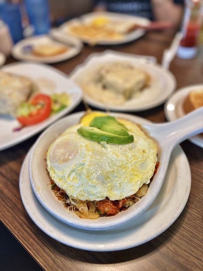 The Border Skillet—where eggs, avocado and spicy goodness collide in a dish that makes you want to high-five the chef.