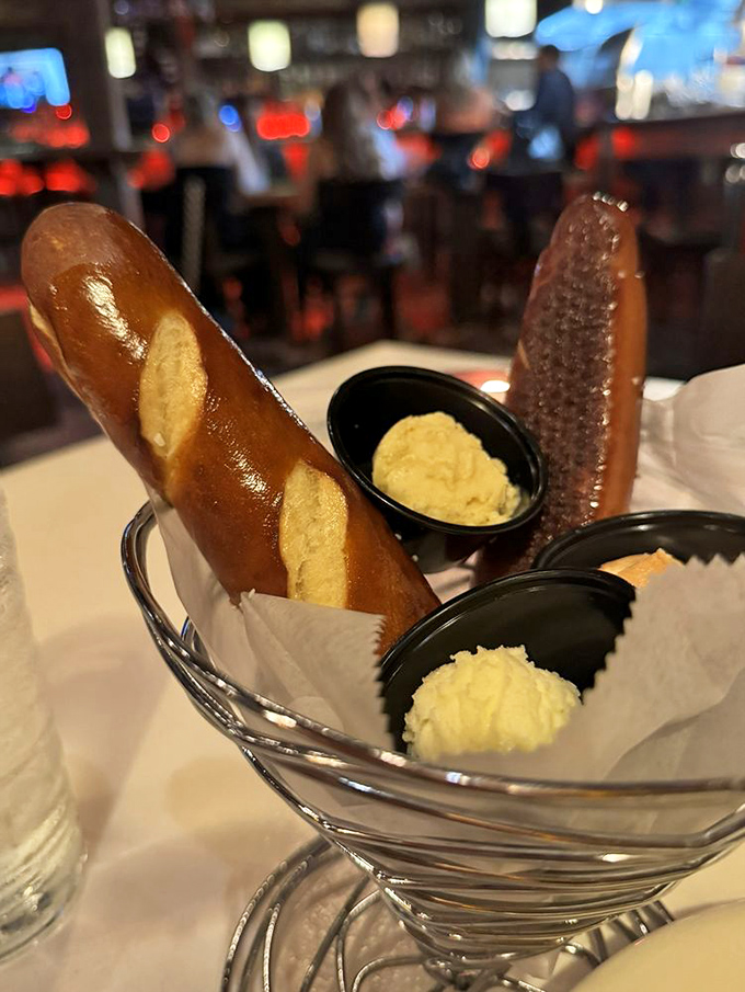 Pretzel breadsticks arrive like warm, buttery exclamation points to the meal ahead, making you wonder why bread baskets ever existed.