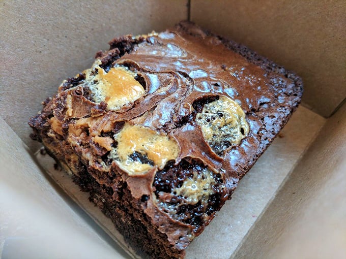 This isn't just dessert; it's the grand finale. A brownie so fudgy and swirled with goodness it deserves a standing ovation.