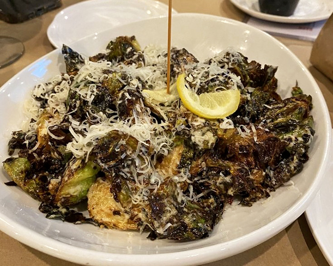 Brussels sprouts that could convert even the most dedicated vegetable skeptic—charred, cheesy, and utterly transformed from their cafeteria reputation.