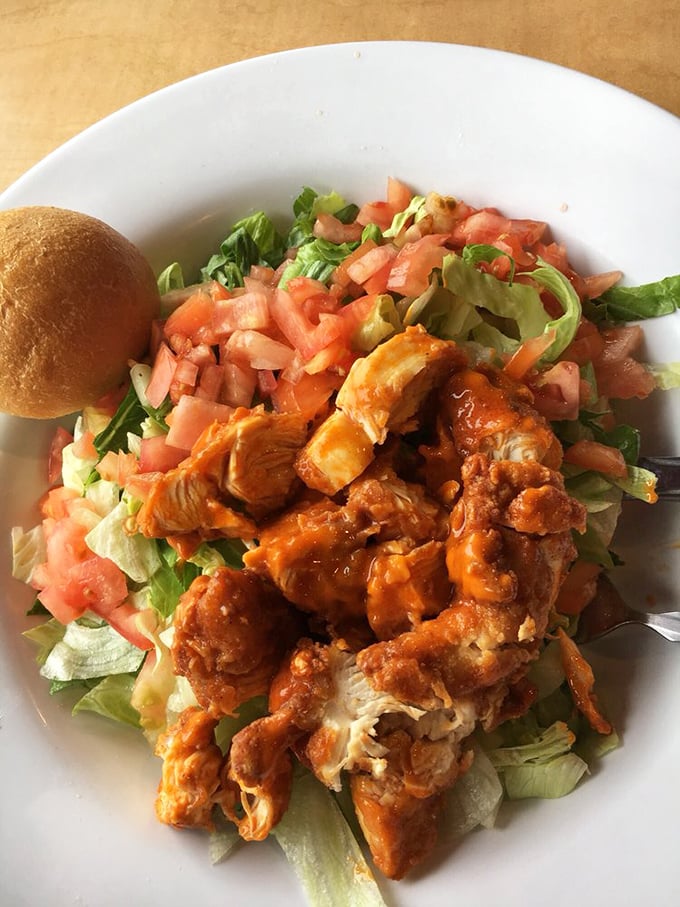 Buffalo chicken goes upscale! This vibrant salad proves Gino's isn't just about burgers—their spicy buffalo chicken adds kick to fresh greens for a meal that feels almost virtuous.