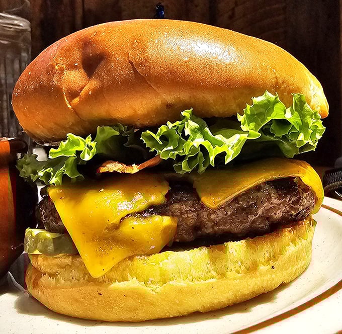 This isn't just a burger; it's a hand-formed testament to beef done right – juicy, cheese-draped, and demanding to be devoured immediately.