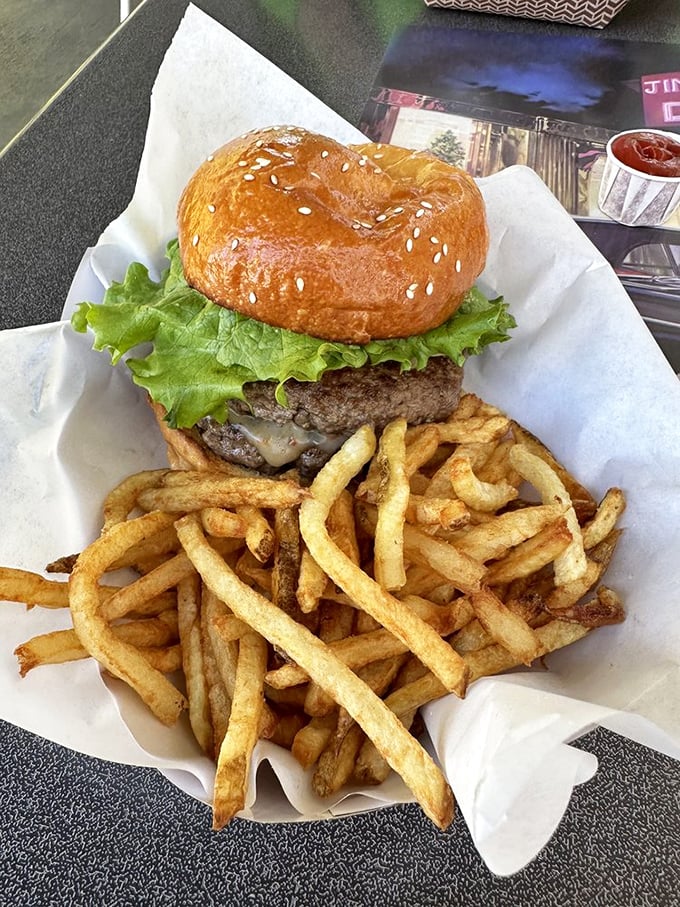 This classic cheeseburger with golden fries isn't trying to reinvent the wheel—it's just perfecting it, one perfectly toasted bun at a time