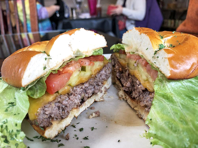 The burger that launched a thousand road trips. That perfect cross-section reveals the juicy truth – this is worth driving for.