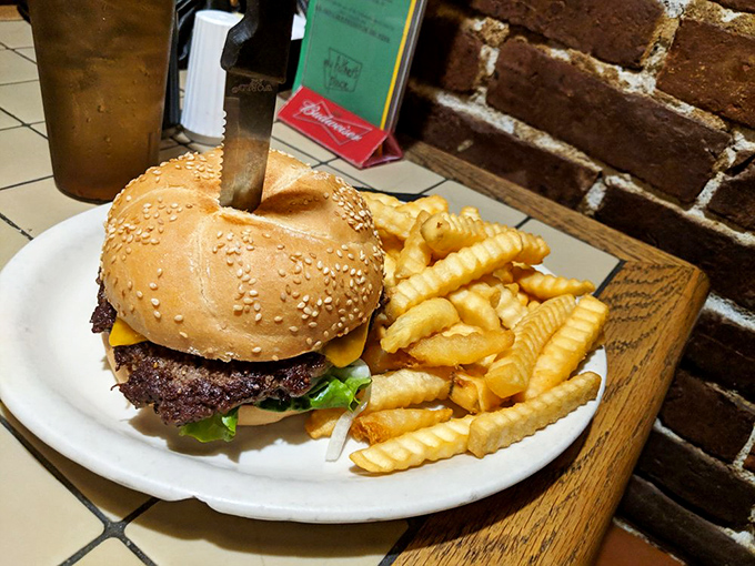 The cheeseburger arrives with zero pretension—just honest beef on a sesame bun with crinkle-cut fries that taste like childhood summers.