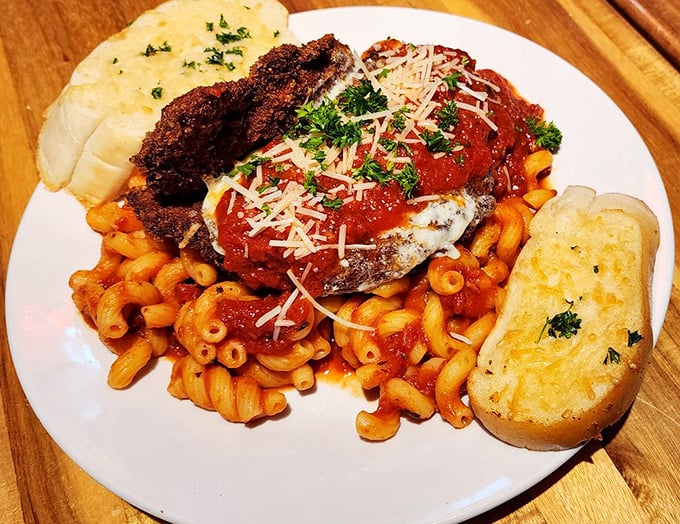 Chicken Parm that doesn't just sit on pasta—it reigns over it with a crown of melted cheese and the confidence of Italian grandmothers everywhere.
