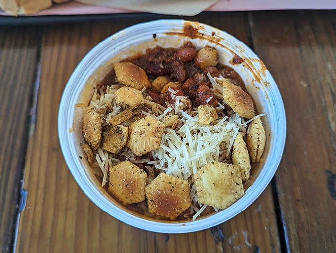 This isn't just chili; it's a hearty bowl of comfort topped with crackers and cheese that would make any Texan tip their hat in respect.