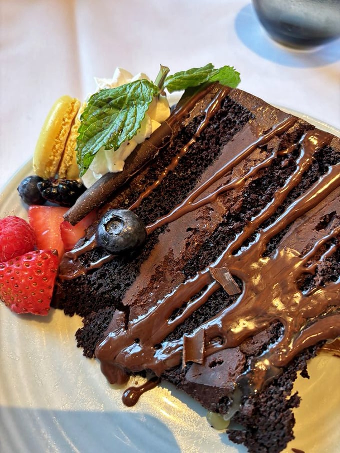 This isn't just chocolate cake – it's a multi-layered monument to decadence that makes counting calories seem like the most ridiculous concept ever invented.