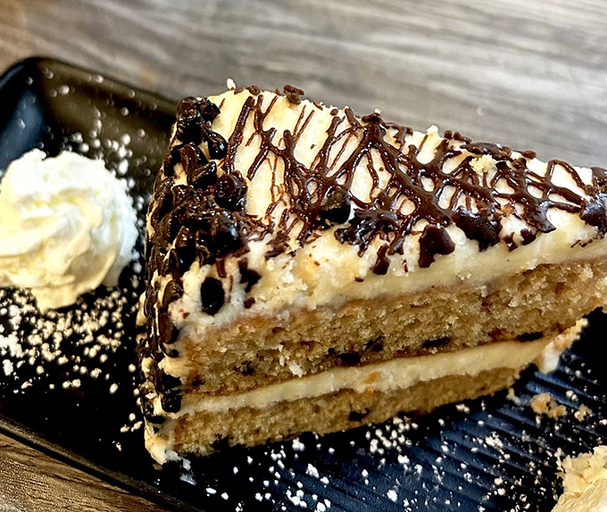 This isn't just cake—it's architecture. Layers of sweet rebellion against your diet plans, drizzled with chocolate surrender.