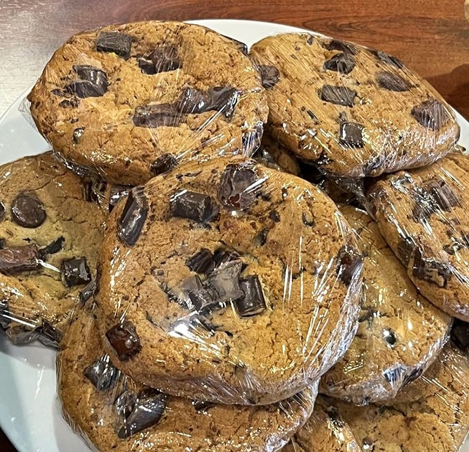 Chocolate chip cookies the size of small planets. These hand-wrapped treats are what cookie dreams are made of—chunky, chewy, and utterly irresistible.