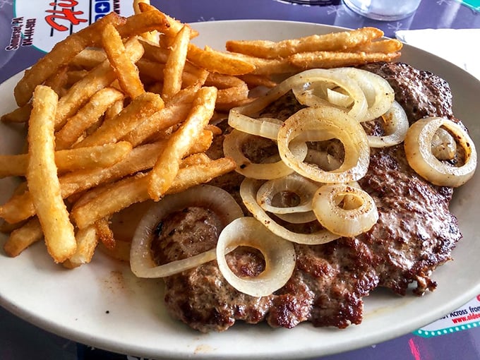 Beefsteak and onions with a golden battalion of french fries – the kind of plate that makes vegetarians question their life choices.