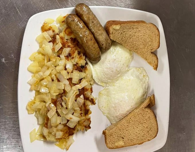The classic American breakfast in its natural habitat: eggs, sausage, home fries, and toast. Simple, honest food that never goes out of style.