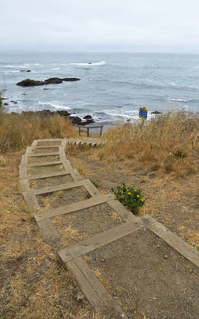 The path less traveled leads to extraordinary rewards—each wooden step brings you closer to California's most dramatic coastal revelation.