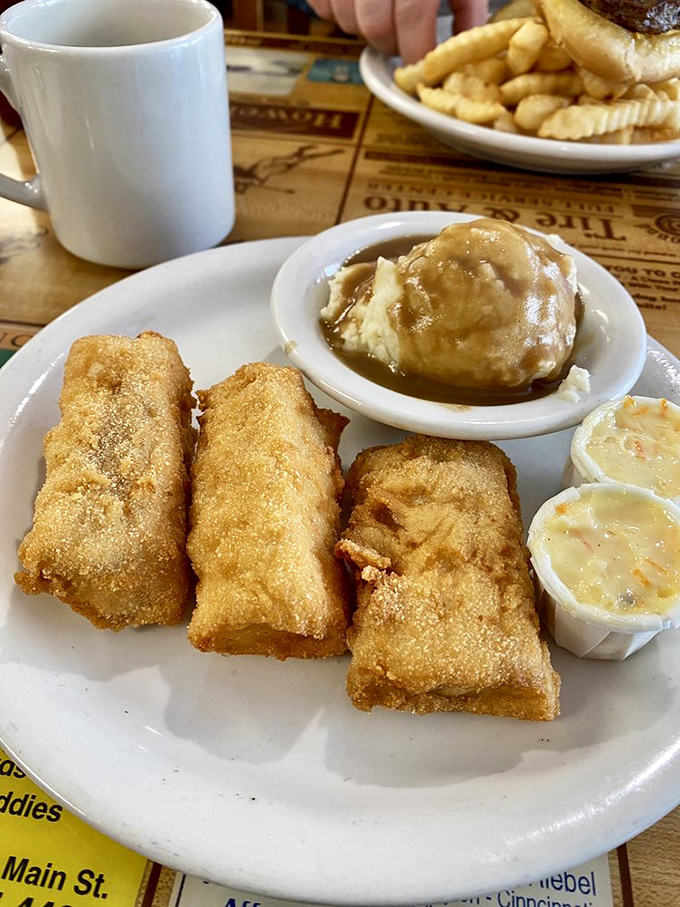 Golden-fried cod that would make New England jealous, served with sides that remind you why diners remain America's culinary happy place.