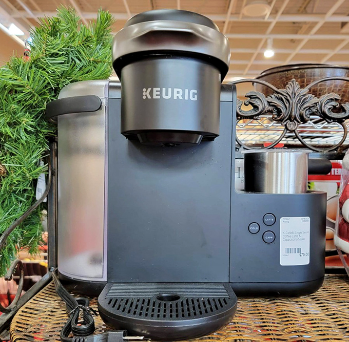 A Keurig coffee maker waiting for its second act—proof that even appliances deserve an encore performance in someone else's kitchen.