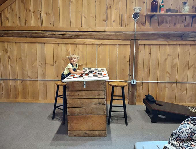 Even the game area maintains the barn aesthetic. Where else can you contemplate your next checker move while digesting world-class pulled pork?