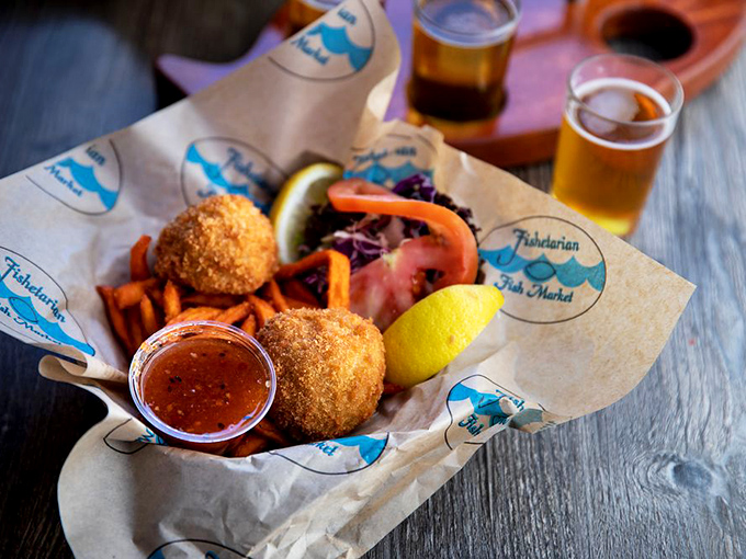 Golden-fried crab cakes that actually taste like crab, not breadcrumbs, served with sweet potato fries that make you question regular potatoes altogether.