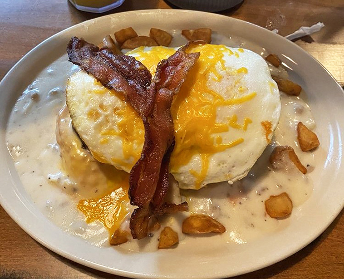 Breakfast skillets here don't mess around—eggs, cheese, bacon, and potatoes converging in a cast iron declaration of morning perfection.