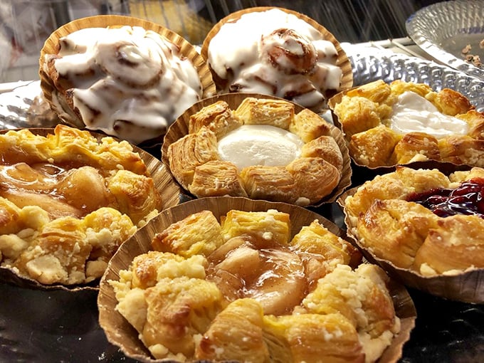 The pastry case—where willpower goes to die. Danish pastries with fruit centers and icing drizzles that make "I'll just have coffee" the biggest lie told daily.