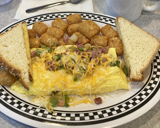 The Denver omelet: where eggs meet the perfect amount of ham, peppers, and cheese. Served with crispy potatoes and toast, it's the breakfast trifecta.