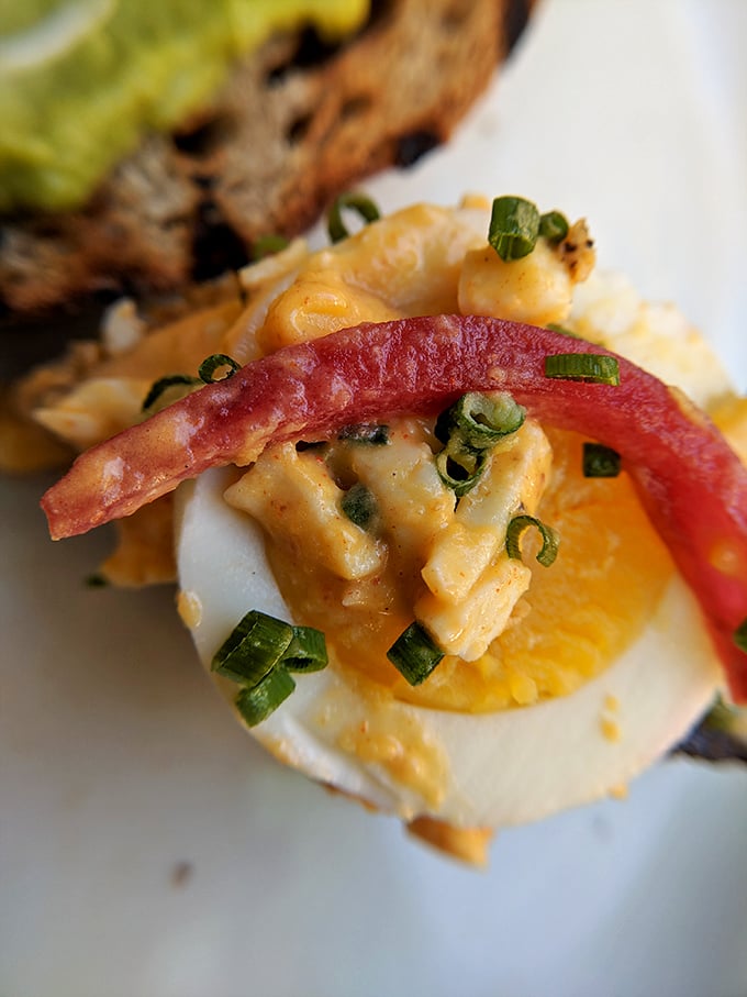 Not your grandmother's deviled egg—unless your grandmother was a culinary genius with a flair for the dramatic. That watermelon radish adds a pop of color worthy of a food magazine cover.