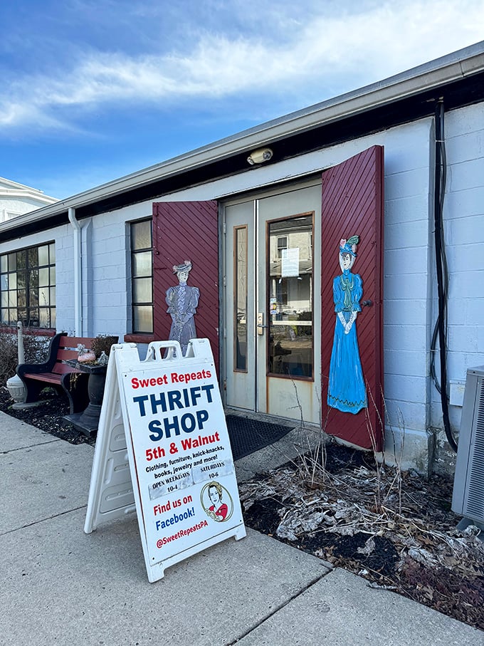 The unassuming entrance with its vintage-inspired signage and painted figures serves as a portal to a world where old becomes new again.