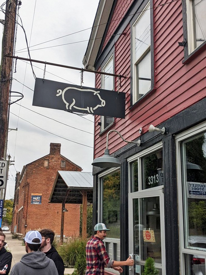 The simple pig sign swinging outside is like a secret handshake—those who know, know. Those who don't are about to join the club. 