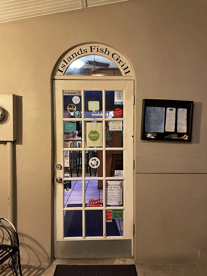 The entrance door, adorned with accolades, stands like a portal to seafood nirvana. Step through and leave ordinary dining behind.