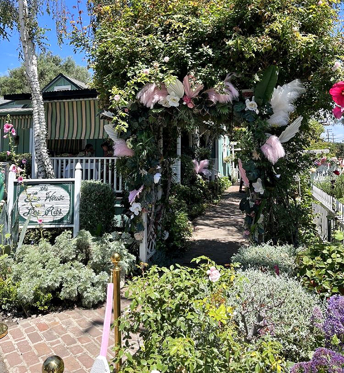 An entrance arch blooming with flowers and promise. Walking through feels like stepping into a secret garden where calories don't count.