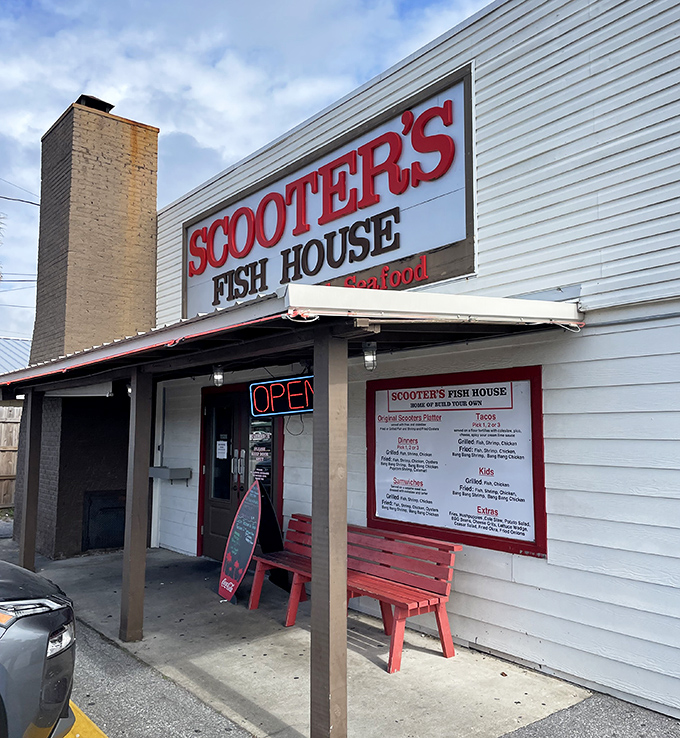 Red bench, weather-worn sign, open door—the Emerald Coast's version of a welcome mat. Once inside, you're no longer a tourist, just hungry.