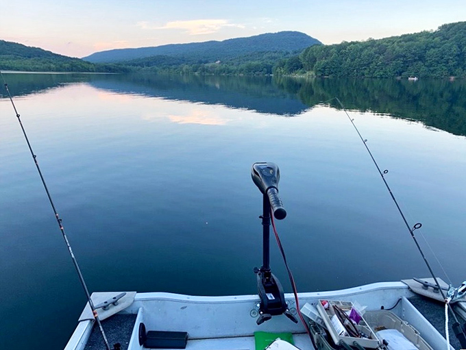 Dawn fishing on Canoe Lake – where "the one that got away" stories are born. Sunrise reflections double your chances of a perfect day.