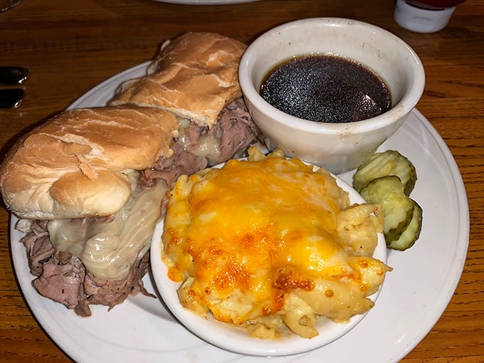 A French Dip that understands its mission: tender beef, melted cheese, and that magical au jus that transforms every bite into a savory revelation.