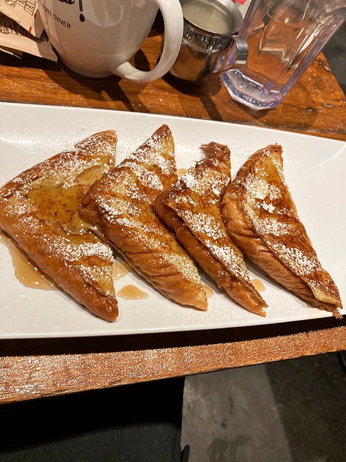 French toast triangles dusted with powdered sugar and drizzled with syrup—breakfast that doubles as dessert and triples as pure morning bliss.