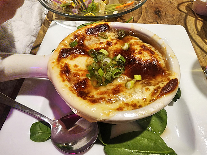 French onion soup that doesn't just warm your stomach—it hugs your soul. That melted cheese cap is the culinary equivalent of a cozy blanket.