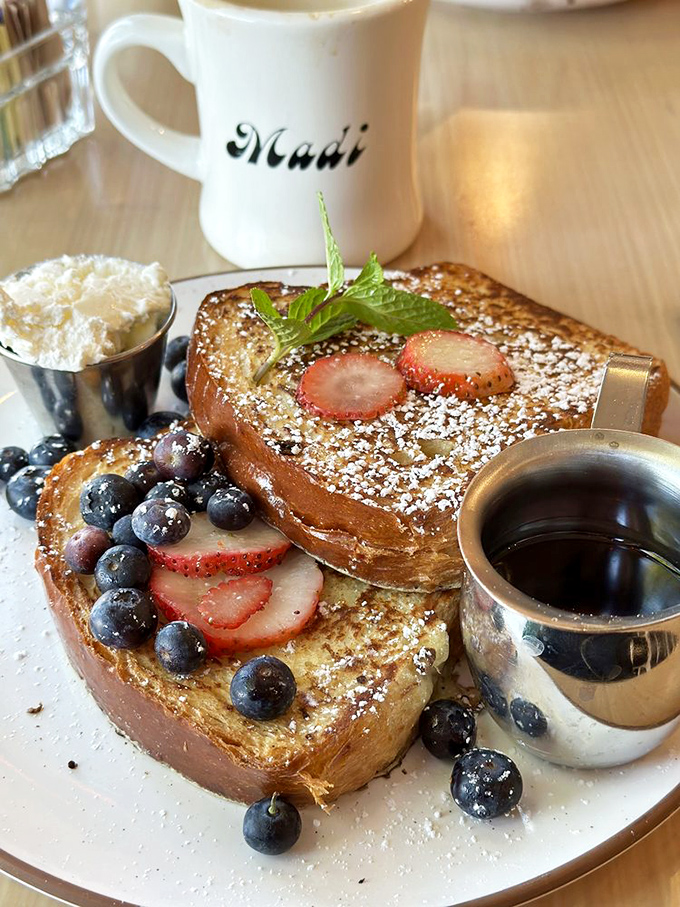 French toast that makes ordinary bread feel inadequate. Those berries aren't garnish—they're jewels in a breakfast crown.