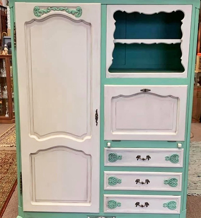 This mint-and-white wardrobe doesn't just store clothes – it's practically the gateway to Narnia for vintage furniture enthusiasts with imagination and space to spare. 