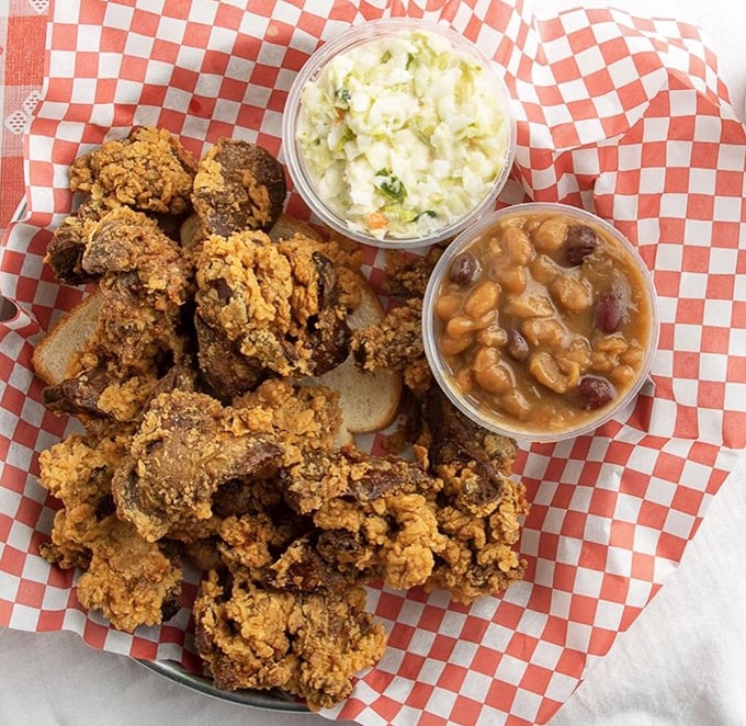 Crispy fried chicken livers—that Southern delicacy that separates the tourists from the locals—served with all the proper fixings.
