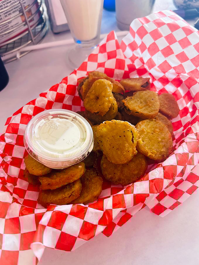Fried pickles: The perfect union of crispy and tangy. These golden discs aren't just appetizers—they're conversation starters with dipping sauce.