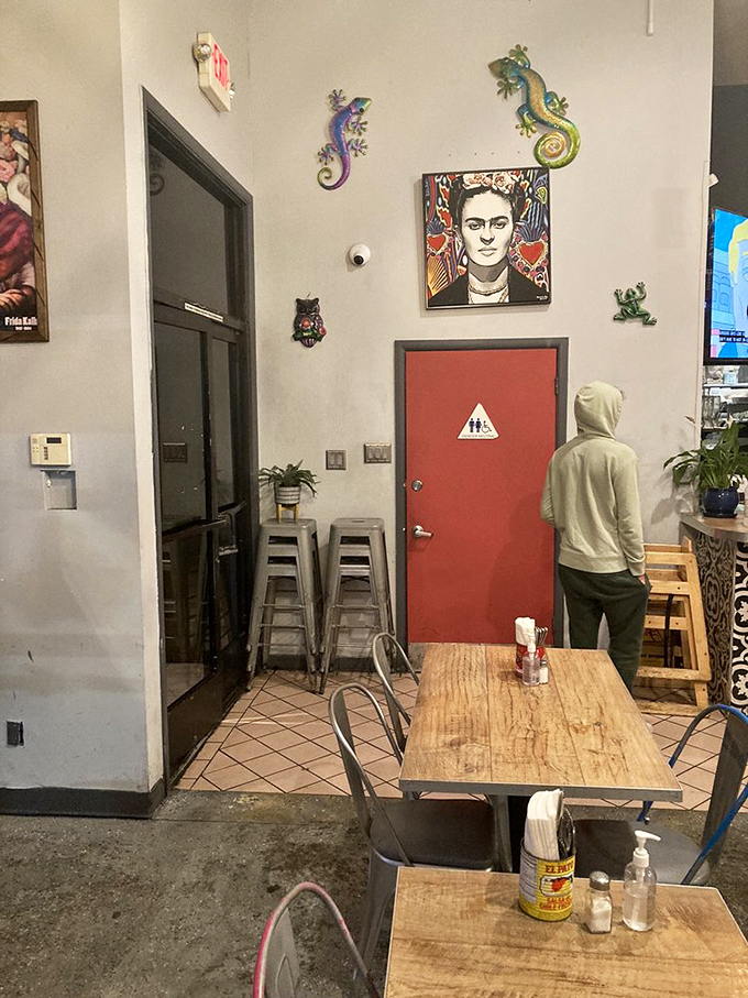 Even the restroom area maintains the restaurant's artistic vibe with colorful lizard sculptures and that signature Frida Kahlo portrait watching over diners.
