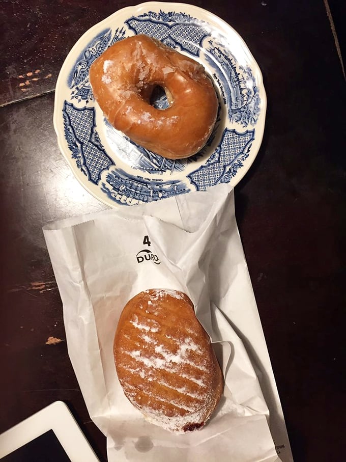 The classic glazed—golden, glistening, and gorgeously simple—rests on vintage china, proving some pleasures need no modern improvement.