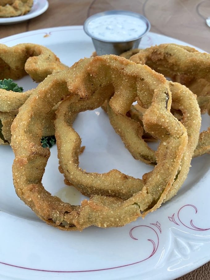 Onion rings that put fair food to shame – golden halos of crunchy, savory goodness that somehow taste even better with an old fashioned.