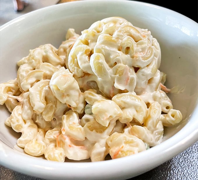 Hawaiian mac salad that's creamier than your favorite bedtime story – the perfect side dish for pretending you're on island time.