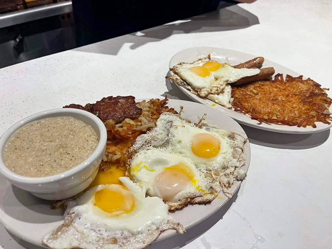 Sunny-side-up eggs with golden hash browns and creamy grits—the breakfast trinity that makes mornings worth facing.Sunny-side-up eggs with golden hash browns and creamy grits—the breakfast trinity that makes mornings worth facing.