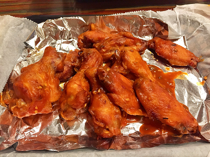 These wings aren't just coated in sauce – they're baptized in it. The kind of finger-licking goodness that makes napkins necessary but optional.
