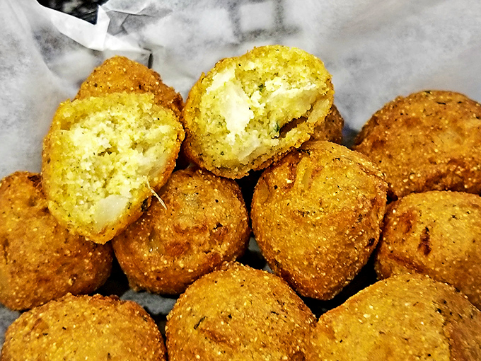 Hushpuppies with the perfect crisp-to-tender ratio—golden orbs of cornmeal joy that somehow manage to upstage even the seafood.