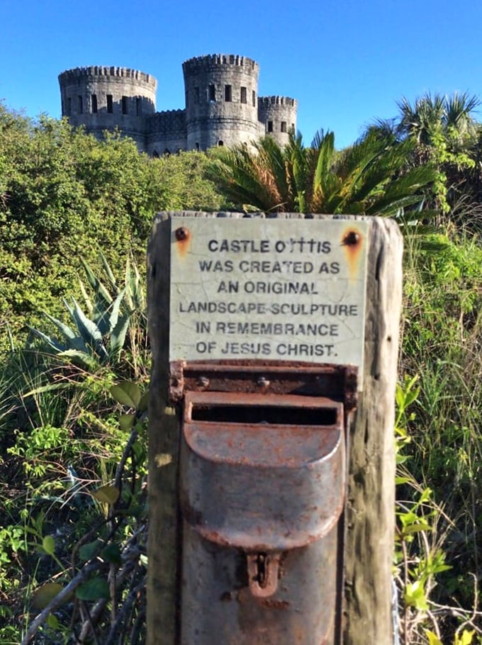 The sign reveals Castle Otttis's true purpose: "an original landscape sculpture in remembrance of Jesus Christ." Not your average tourist attraction!
